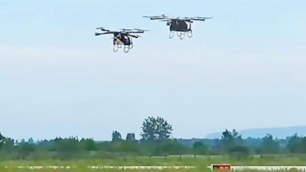 Flying cars crash into each other at air show in China - BBC News