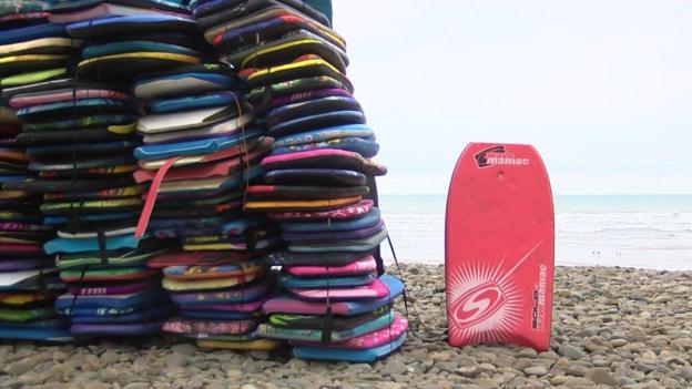 Discarded bodyboards litter Cornish beach - BBC News