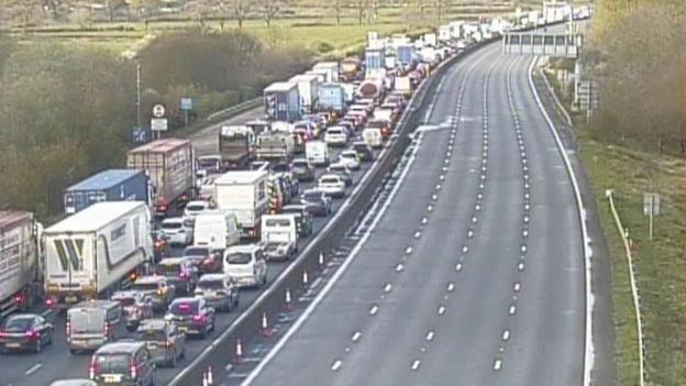 M20: Kent motorway reopens after Operation Brock controls end - BBC News