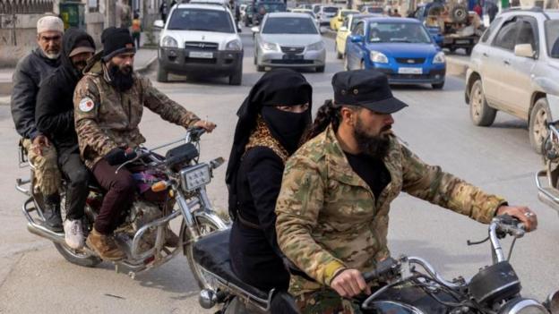 Syria rebel leader dismisses controversy over photo with woman - BBC News