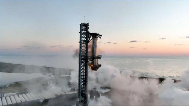 Space X: Rocket booster caught in mid-air for the first time - BBC ...