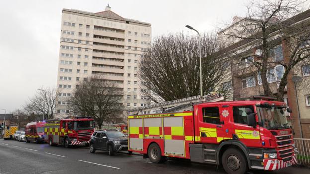 Teenager charged after three injured in tower block fire - BBC News