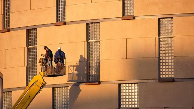 Dangerous cladding: 'Fire patrols at our flats cost us £500,000' - BBC News