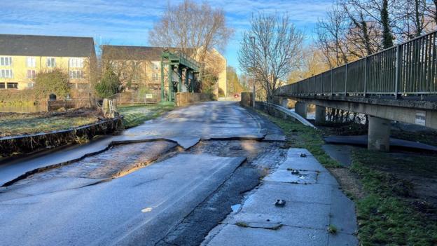 Flood-hit road in St Neots to reopen after 'substantial repair' - BBC News