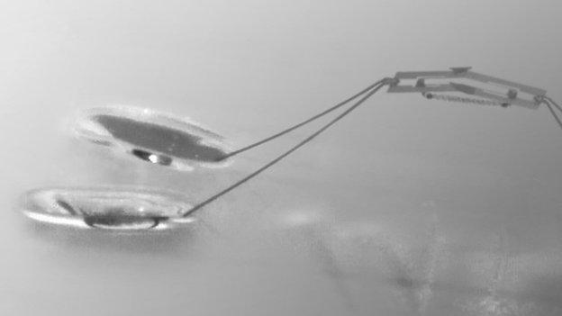 Robot can leap from water's surface - BBC News