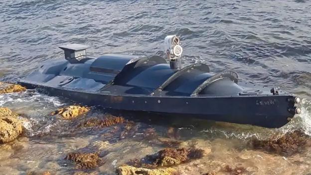 Royal Navy 'wolf pack' drone boats in warship trial success - BBC News