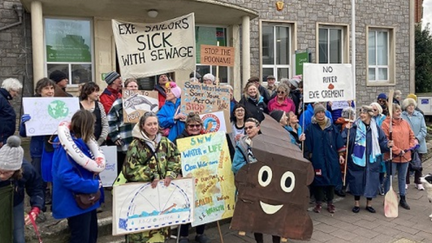 Dozens join protest against sewage discharges into rivers - BBC News