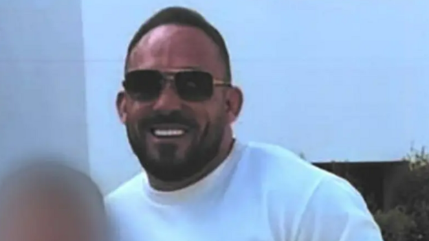 Moment murderer John Belfield taken off plane and arrested - BBC News