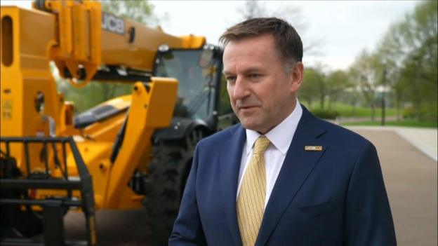 Staffordshire-based JCB doubles USA factory size due to tariffs - BBC News