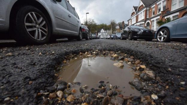Surrey County Council launches new pothole reporting tool - BBC News