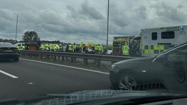 Two injured and drivers warned of delays after M8 crash near airport ...