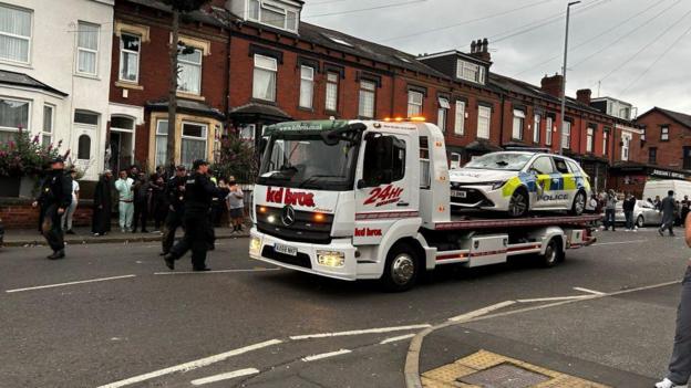 Harehills: Bus destroyed and police car flipped in Leeds disorder - BBC ...