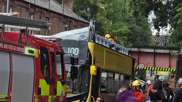 Eccles: Fifteen hurt as double-decker bus hits bridge - BBC News