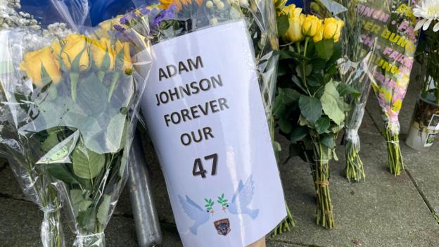 Fans pay tribute to ice hockey player Adam Johnson one year on - BBC News