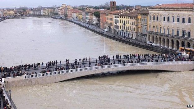 Italy battles floods as bad weather batters Europe - BBC News
