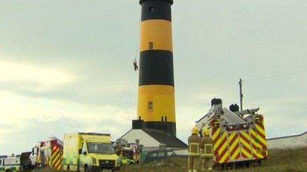 Killough: Painter rescued after getting stuck halfway up lighthouse ...