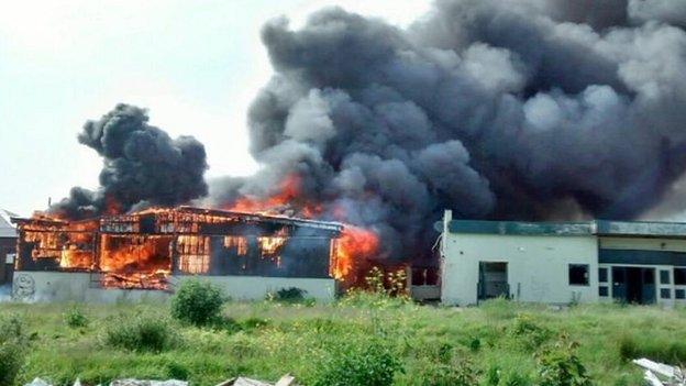 Brixham ex-holiday park fire: Five teenagers arrested - BBC News