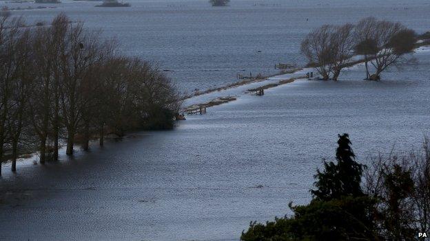 Extreme flooding events influence UK climate views - BBC News