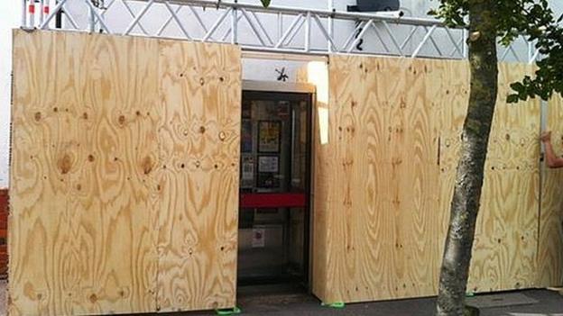 Banksy Cheltenham Spy Booth artwork 'to be removed' - BBC News