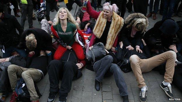 Why are people face-sitting outside Parliament? - BBC News