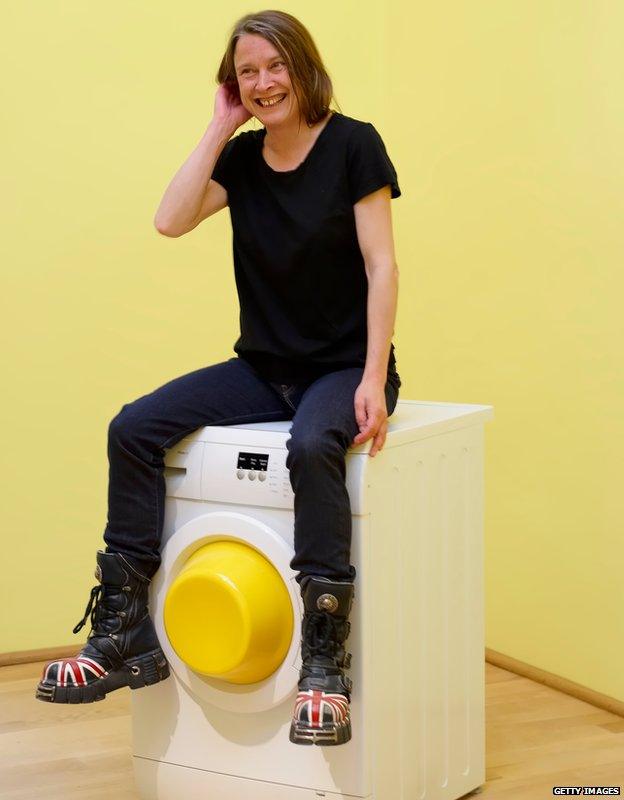 Sarah Lucas unveils bawdy British show at Venice Biennale - BBC News