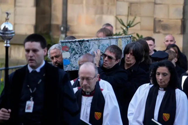 Stone Roses' Ian Brown pays tribute to Mani at funeral - BBC News