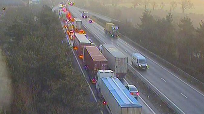 Man dies after lorry overturns on A14 - BBC News