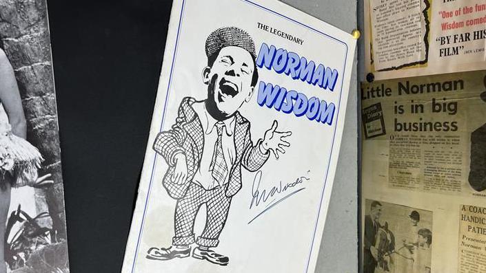 Sir Norman Wisdom exhibition opens in his hometown of Deal - BBC News