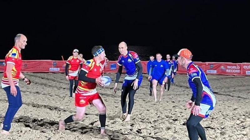 Poole touch rugby team's 34-hour beach match confirmed as record - BBC News