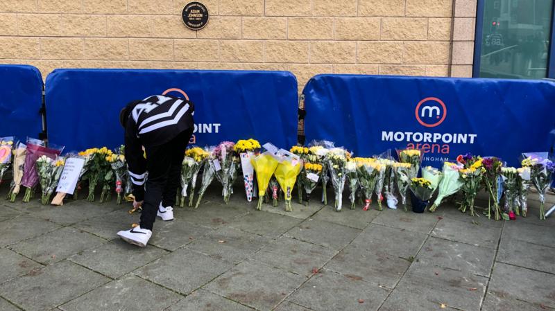 Fans pay tribute to ice hockey player Adam Johnson one year on - BBC News