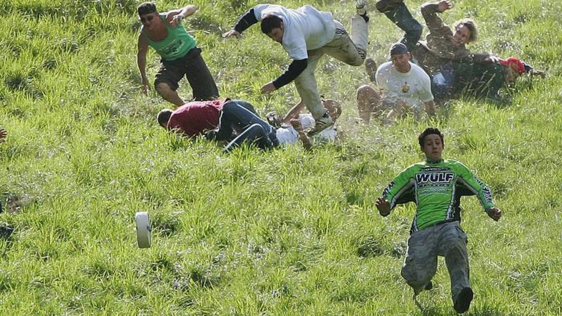 Cheese-rolling veteran equals all-time record - BBC News