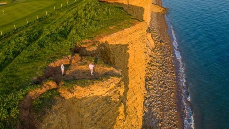 Storm Ciarán causes section of West Bay cliff to collapse - BBC News