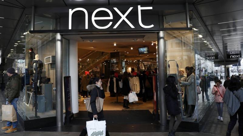 Next slashes Wolfson's pay by half after profits slide - BBC News