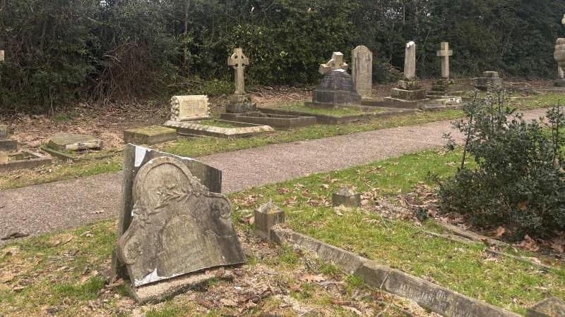 Whitchurch gravestones 'decimated' by falling tree branch - BBC News