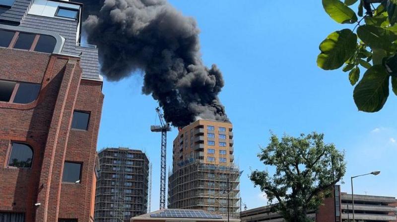 Staines: Huge plume of smoke as fire engulfs tower block - BBC News