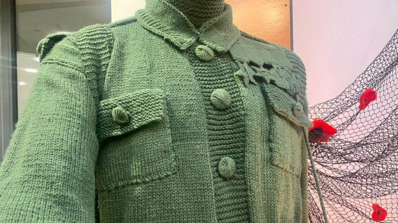 Life-sized remembrance soldier created by knitters - BBC News