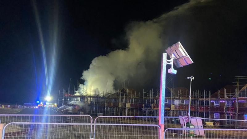 Crews tackle fire at building site at Wixams near Bedford - BBC News