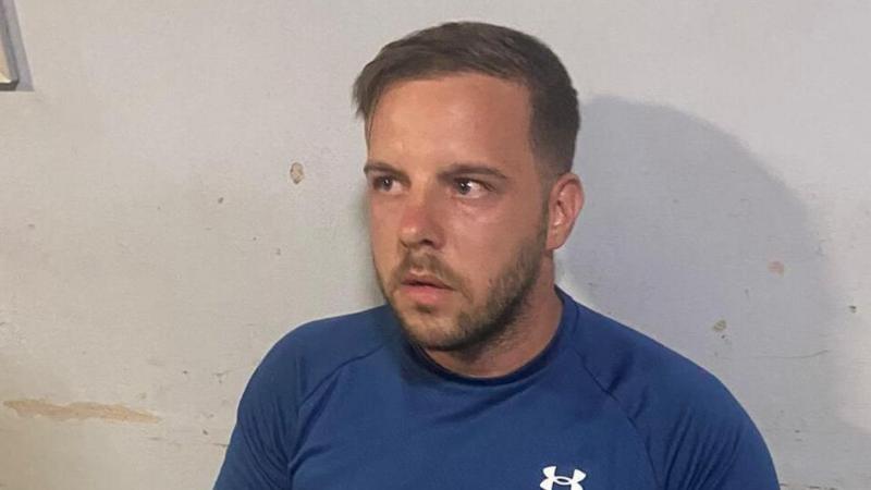 Moment murderer John Belfield taken off plane and arrested - BBC News