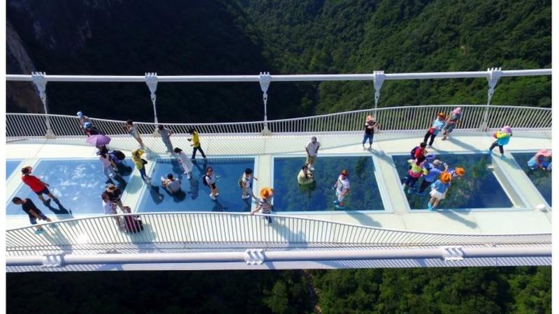 Glass bridge: China opens world's highest and longest - BBC News