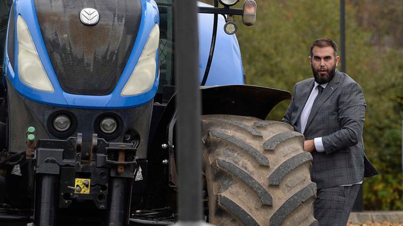 Luke Poots fined for using phone while driving tractor - BBC News