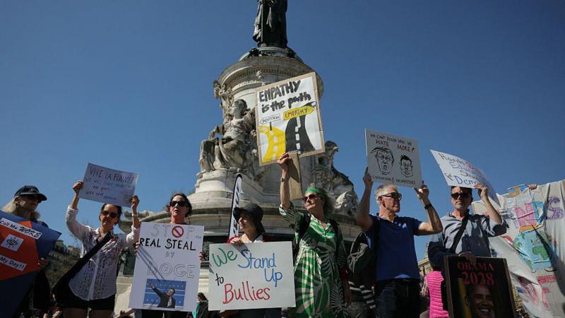 'Hands Off': Anti-Trump protests held in cities across the US - BBC News