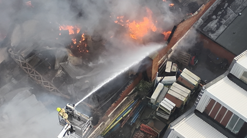 Up to 70 firefighters remain at Wolverhampton factory fire scene - BBC News