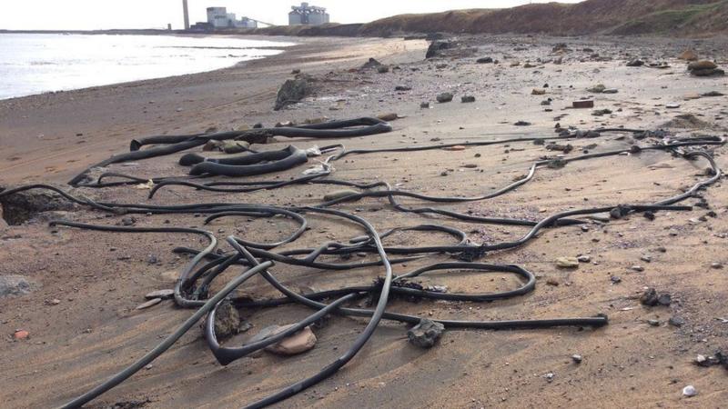 Lynemouth beach clean-up sees 70 years of waste removed - BBC News