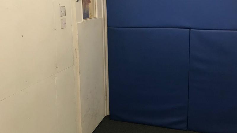 'Hundreds of pupils spend week in school isolation booths' - BBC News