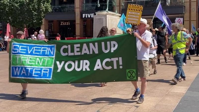 Dozens join protest against sewage discharges into rivers - BBC News
