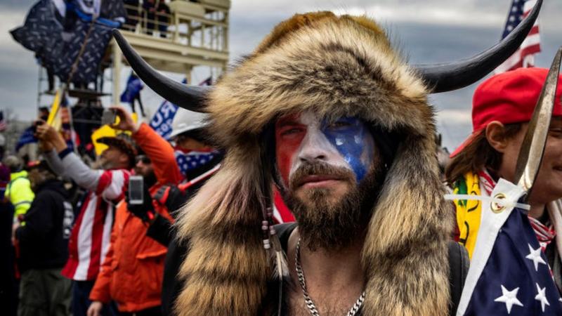 'QAnon Shaman' freed early from federal prison - BBC News