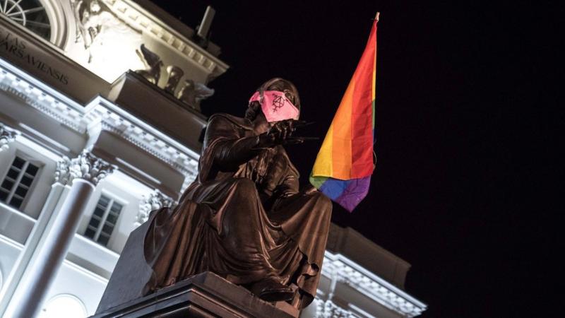 Poland LGBT protests: Three charged with hanging rainbow flags off ...