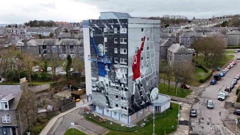 Denis Law: Aberdeen high-rise murals honour a giant of the game - BBC News
