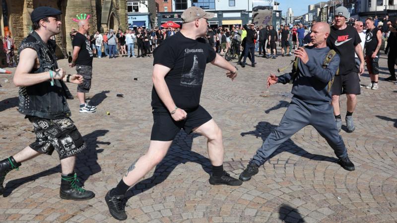 Chairs and bottles thrown as protesters clash in Blackpool - BBC News