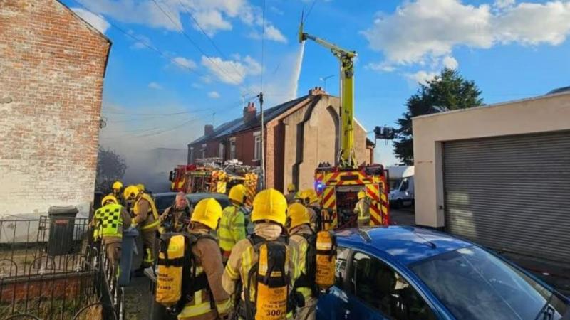 Crews remain at scene of disused building fire in Crewe - BBC News
